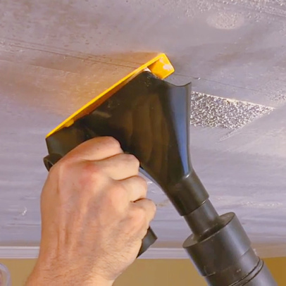 Popeeze: Popcorn ceiling scraper tool with vacuum attachment