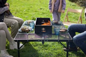 AroundFire is a portable table for grill, campfire, and outdoor cooking