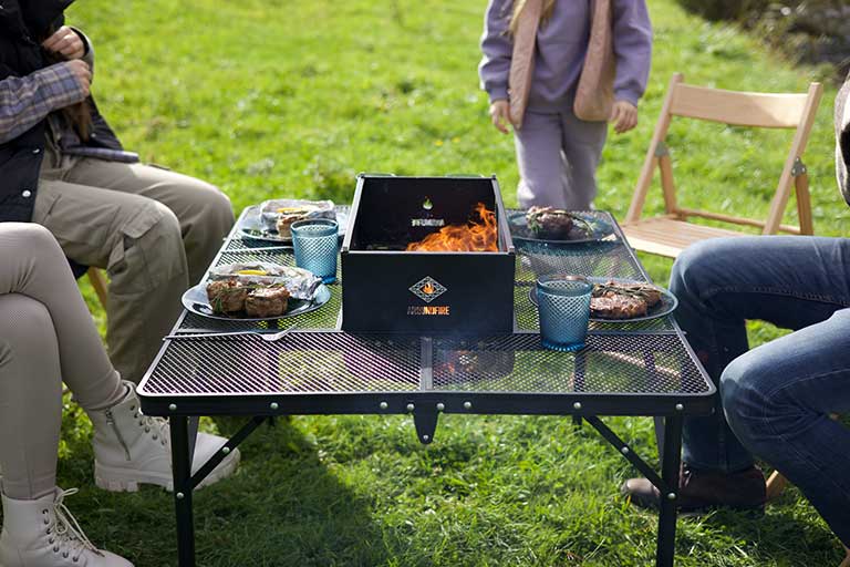 AroundFire is a portable table for grill, campfire, and outdoor cooking