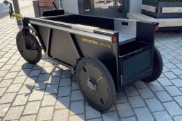 The four-wheeled Intelectra Cargo Bike has a pickup truck-like bed for ...