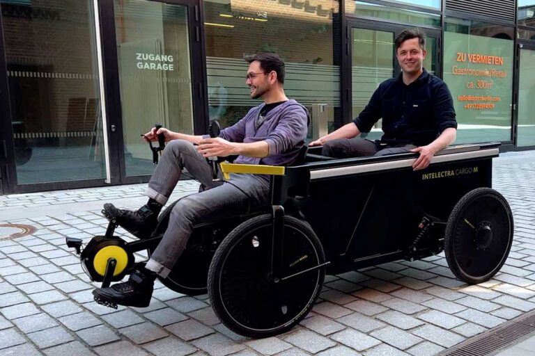 The four-wheeled Intelectra Cargo Bike has a pickup truck-like bed for ...